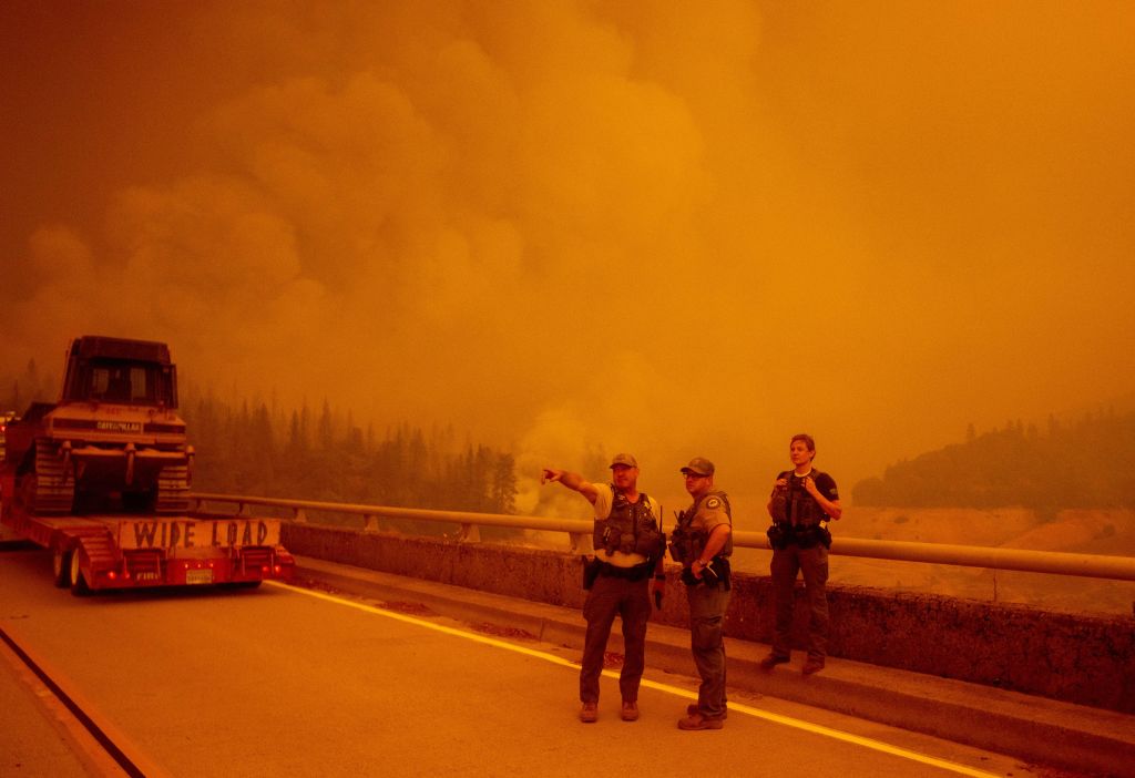 US towns destroyed as firefighters battle wildfires under orange skies ...